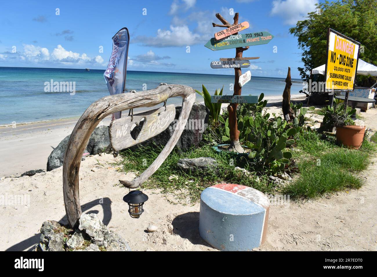 Signs on the seashore of Swallow's Bay, Tobago Stock Photo - Alamy