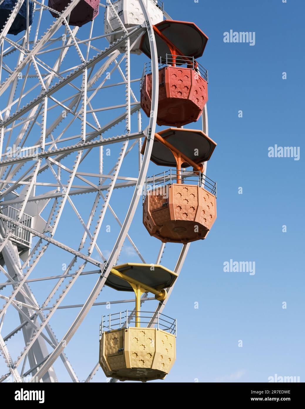 A stunning view of a Ferris wheel featuring many vibrant, multi-hued ...