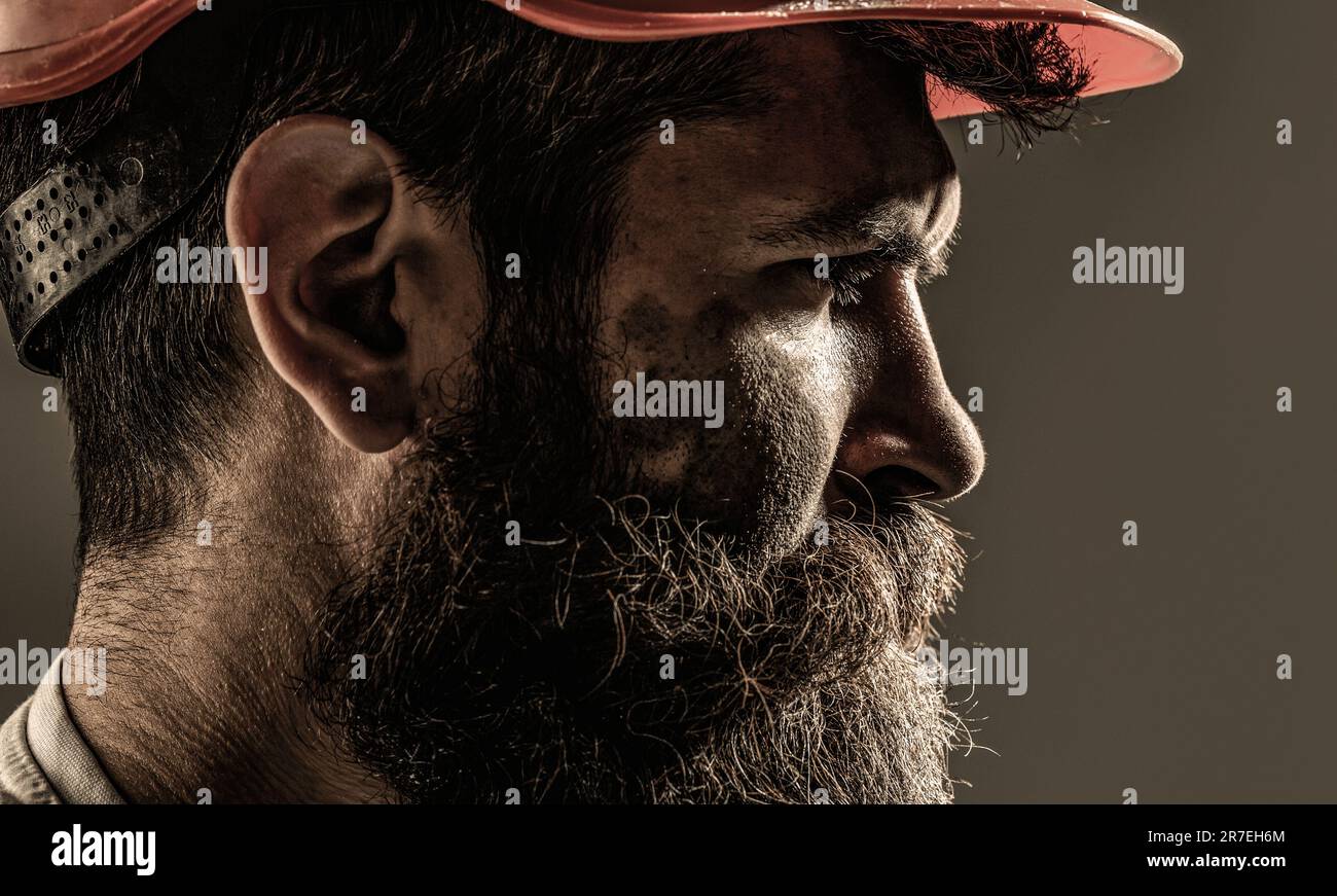 Foreman or repairman in the helmet. Bearded man worker with beard in ...