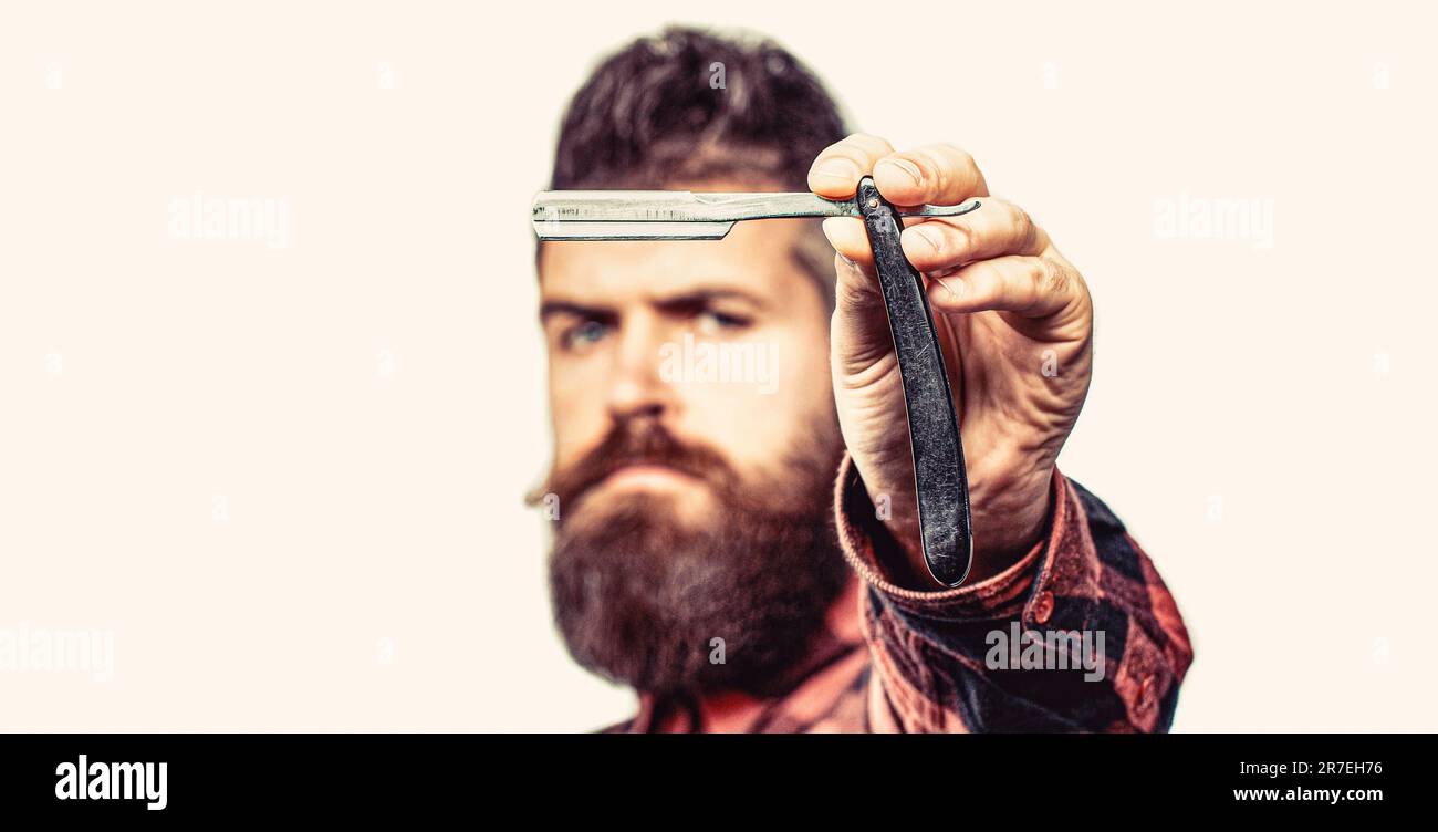 Mens haircut. Man in barbershop. Handsome bearded hairdresser is ...