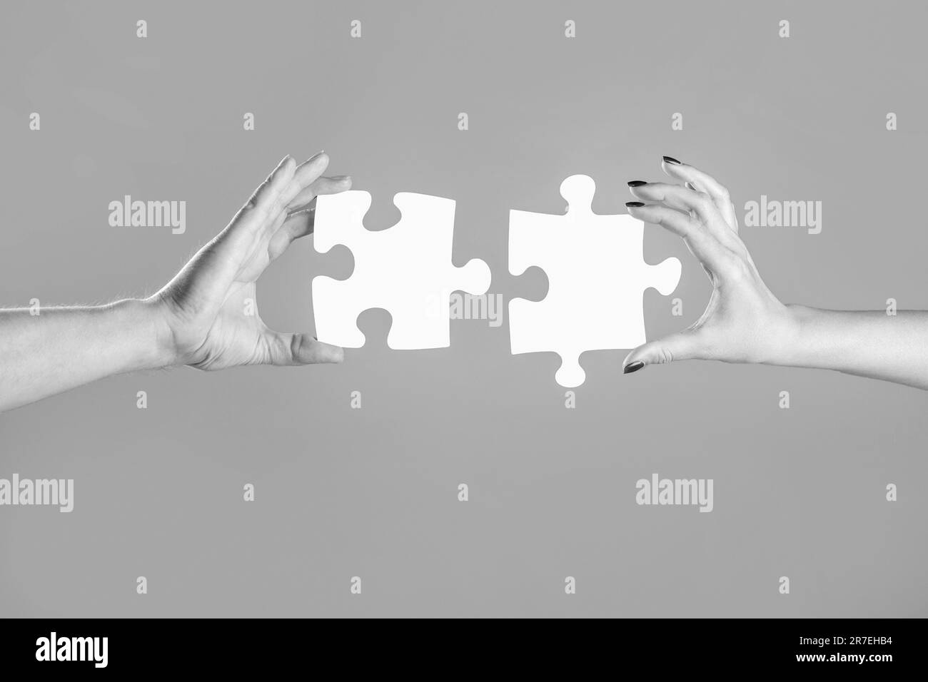 Closeup hand of connecting jigsaw puzzle. Business solutions, success ...