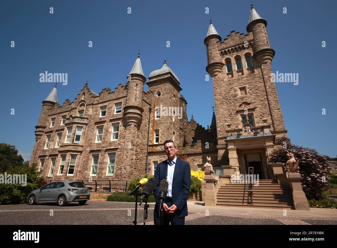 Alliance party MLA Andrew Muir talking to the media at Stormont Castle ...
