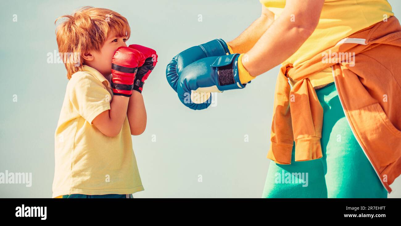 Little boy sportsman at boxing training with coach. Sports man coaching ...