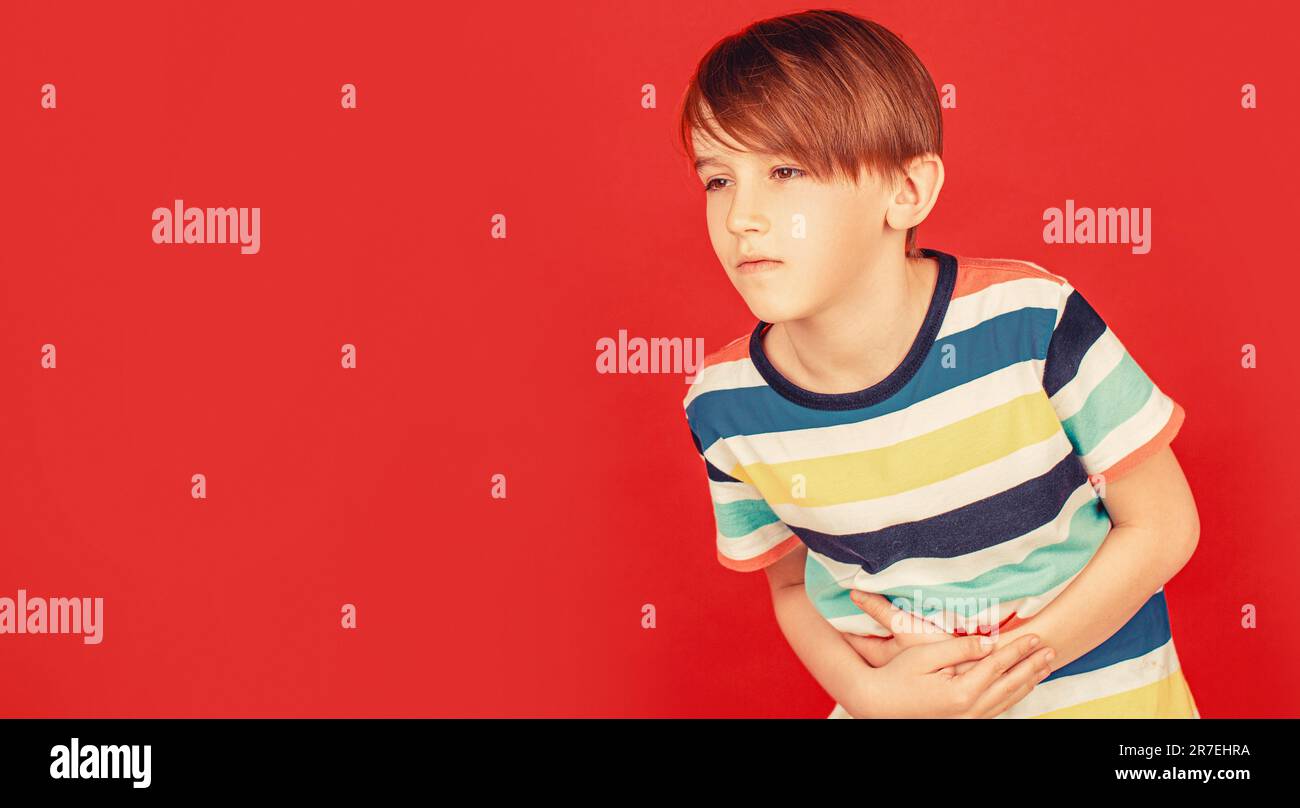 Teen boy with stomachache. Child having terrible pain in stomach ...