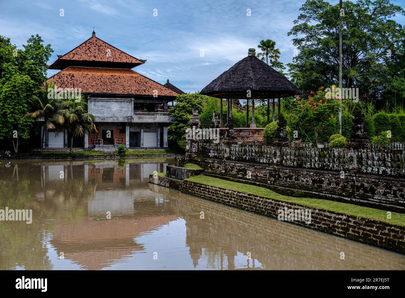 Photo of a building exterior along a waterway on the grounds of the ...