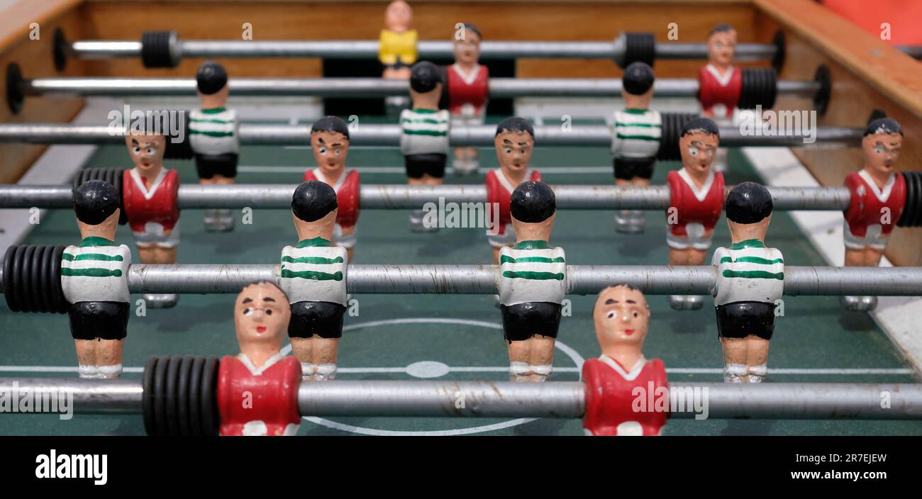 Figurines on a vintage foosball table Stock Photo - Alamy