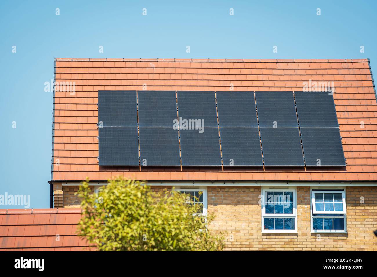 solar panels on roof of new houses in england uk on bright sunny day ...