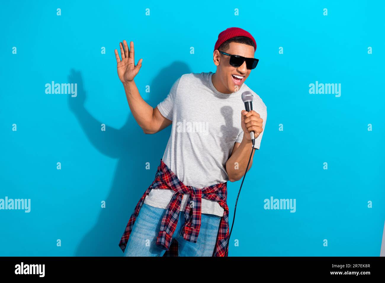 Photo of funky overjoyed person have good mood hand hold microphone ...