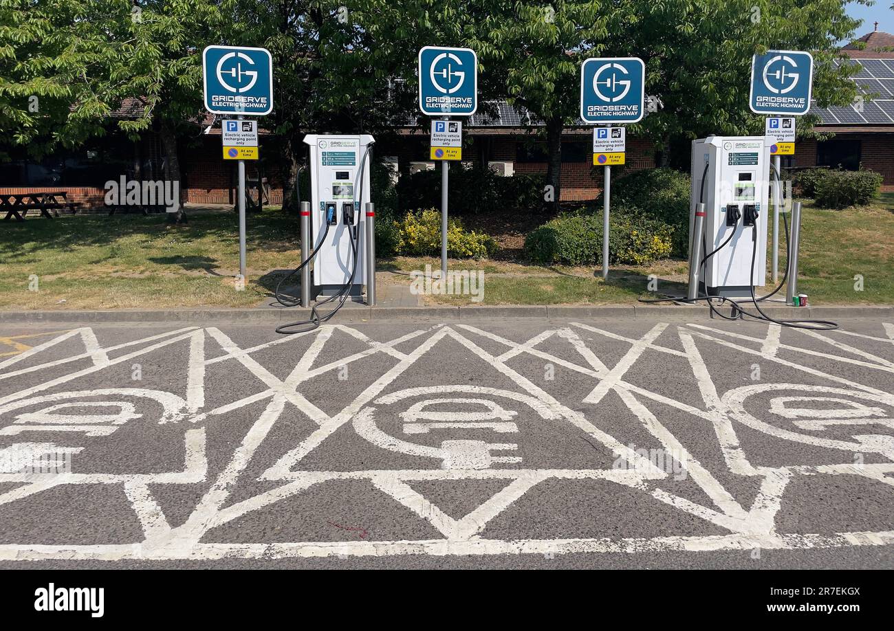 Westerham, Kent, England, UK. 2023. Electric vehicle battery charging points in a service ...