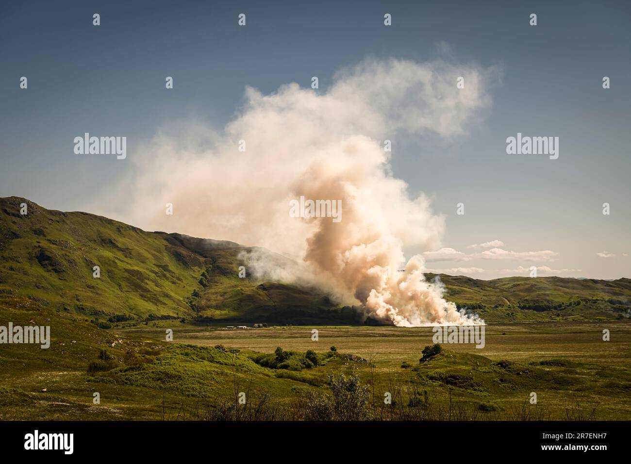 A summer HDR image of stubble being burnt off in a field during a very ...