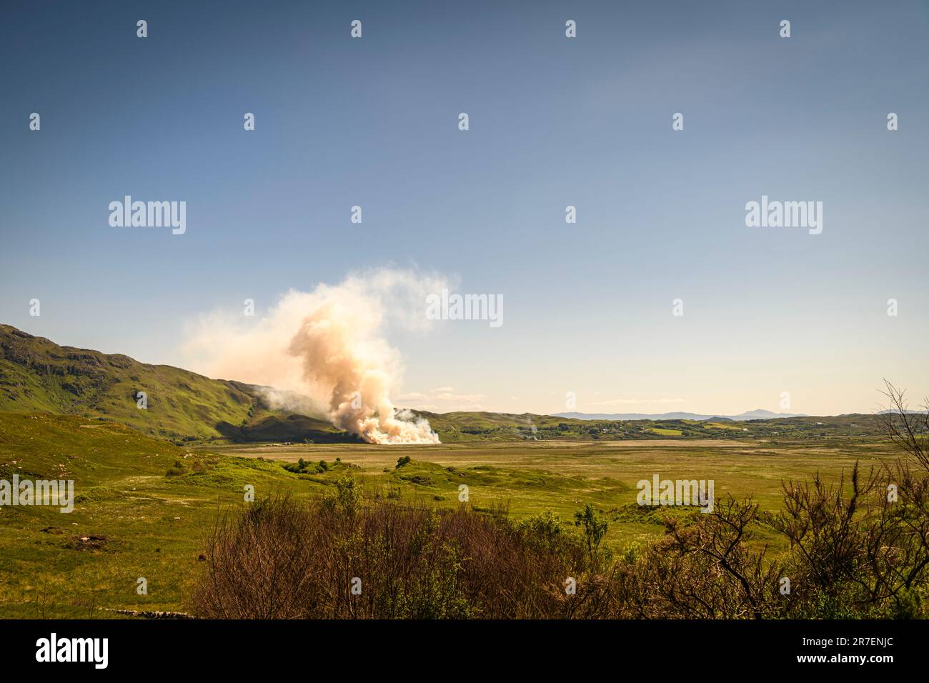 A summer HDR image of stubble being burnt off in a field during a very ...