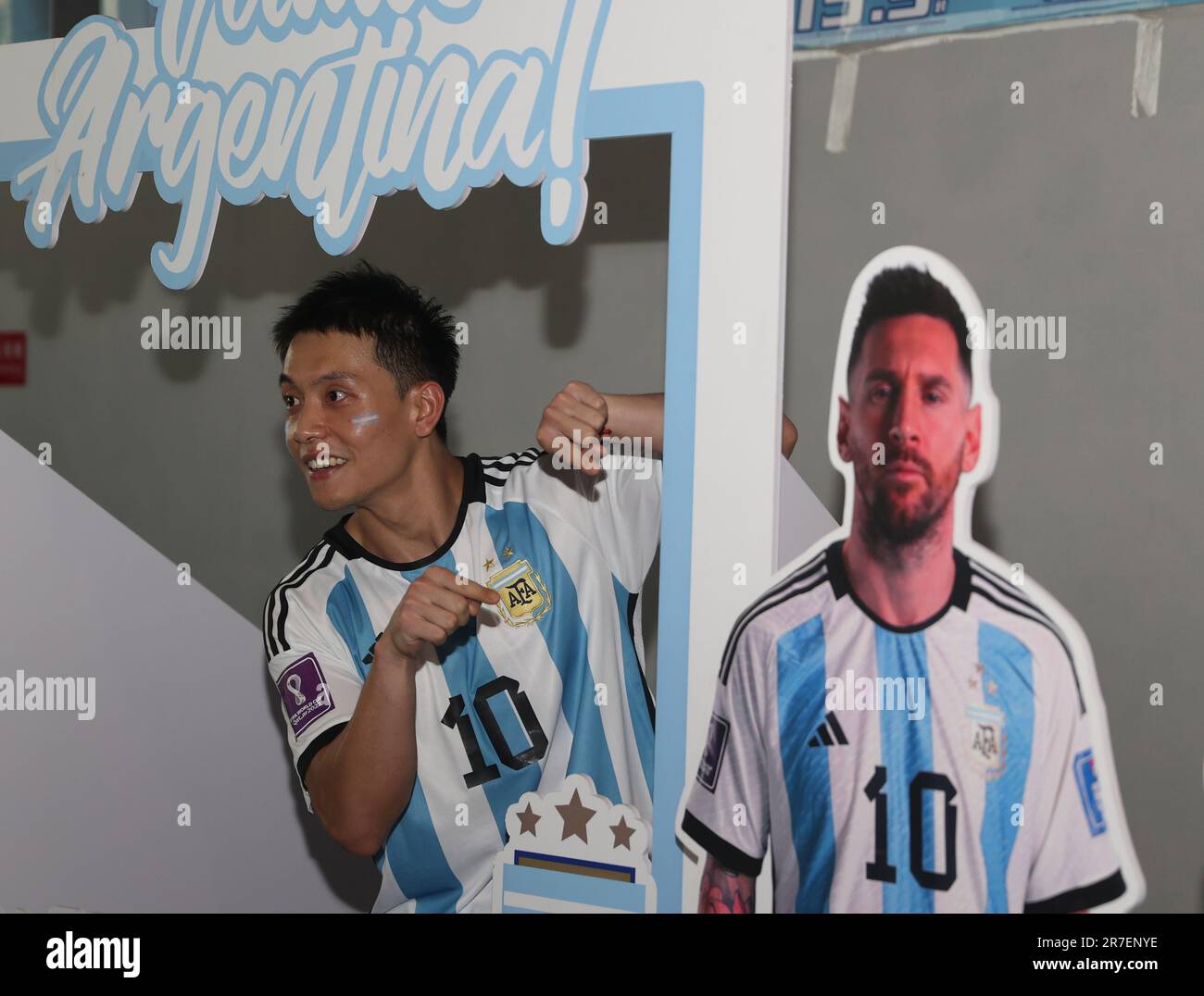 Beijing, China. 15th June, 2023. A fan poses with a figure of Lionel ...