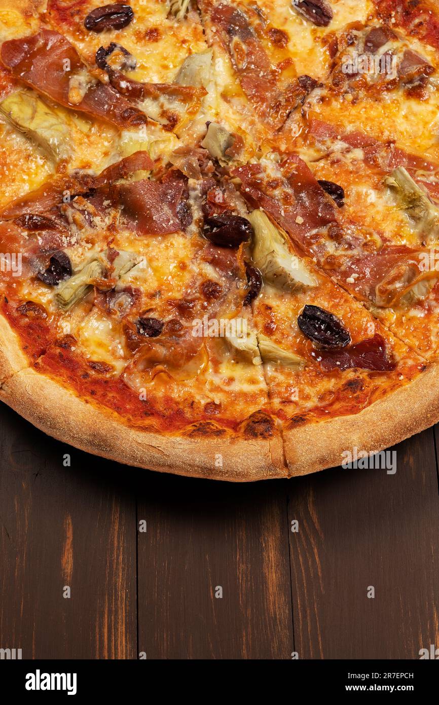 Pizza with tomato sauce, mixed cheese selection, ham, pepperoni, bacon, fresh mushrooms and ...