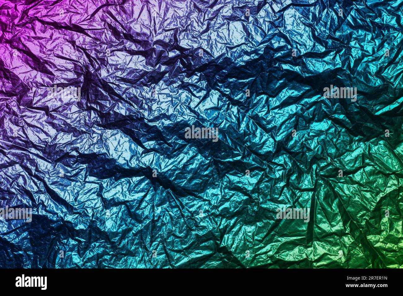Shiny metallic foil texture with color gradient Stock Photo - Alamy
