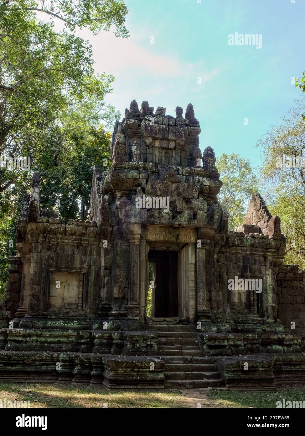 Ancient Khmer Empire stone structure nestled within a forest in ...