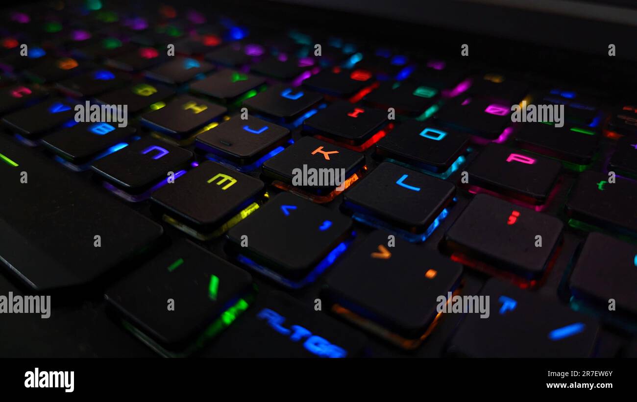 This laptop has a keyboard with a few glowing key keys Stock Photo - Alamy