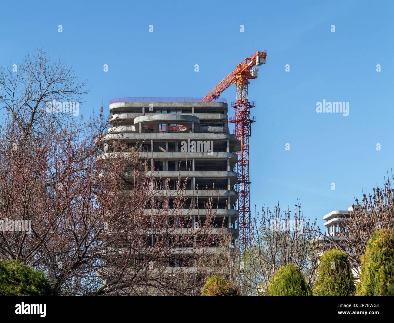 The subject of the photo is the construction of a building of a ...