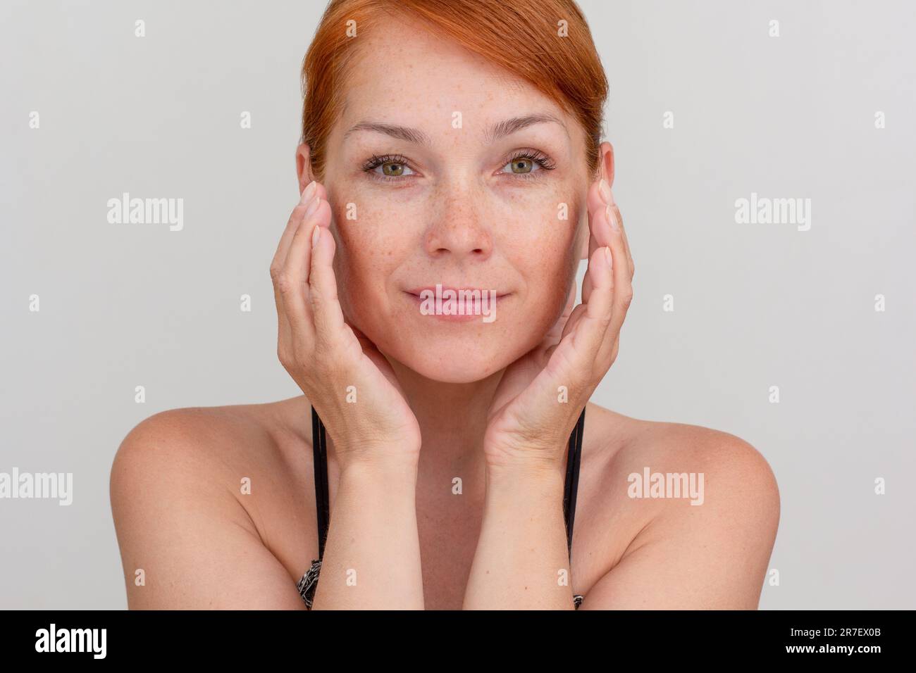 Portrait of cropped caucasian middle aged woman face with freckles ...
