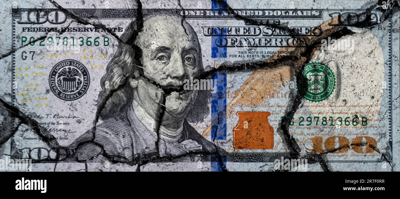 Hundred dollar bill with cracks. US dollar banknote broken into pieces ...