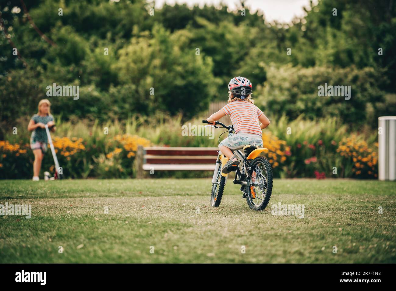 Cute little boy riding bicycle in the park, sport for children, active ...