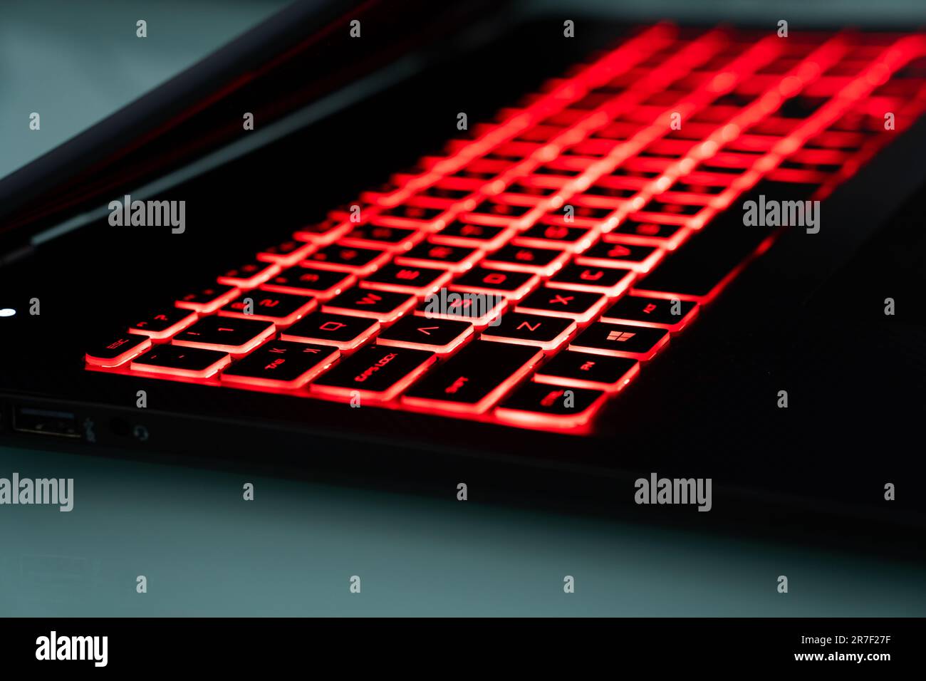 Gaming laptop keyboard with led red light Stock Photo - Alamy