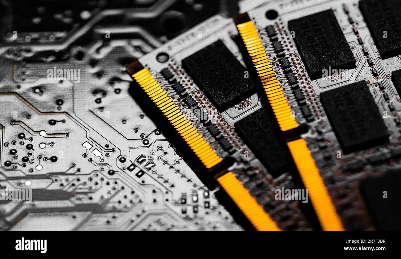 Macro Close up of computer RAM chip and motherboard on dark background ...