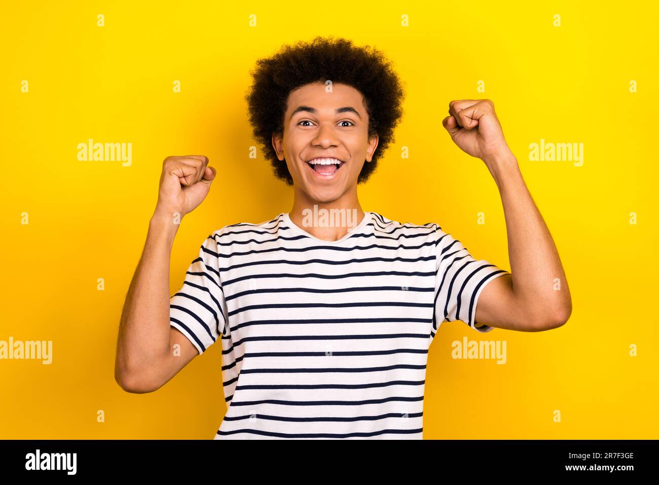 Photo of young shout positive guy raised fists up celebrate his victory ...