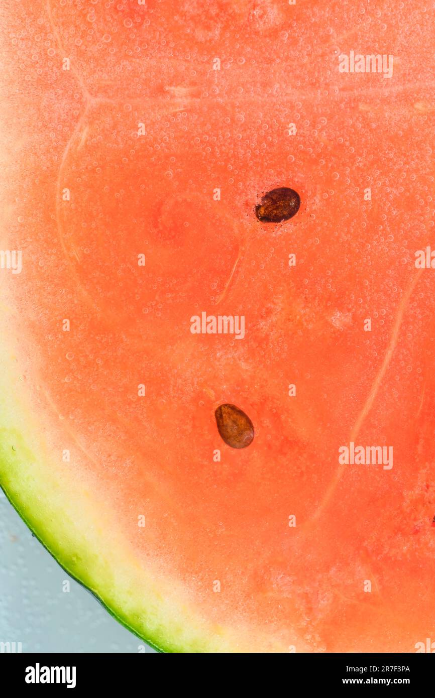 Slice of ripe watermelon in water. Close-up of watermelon in liquid ...