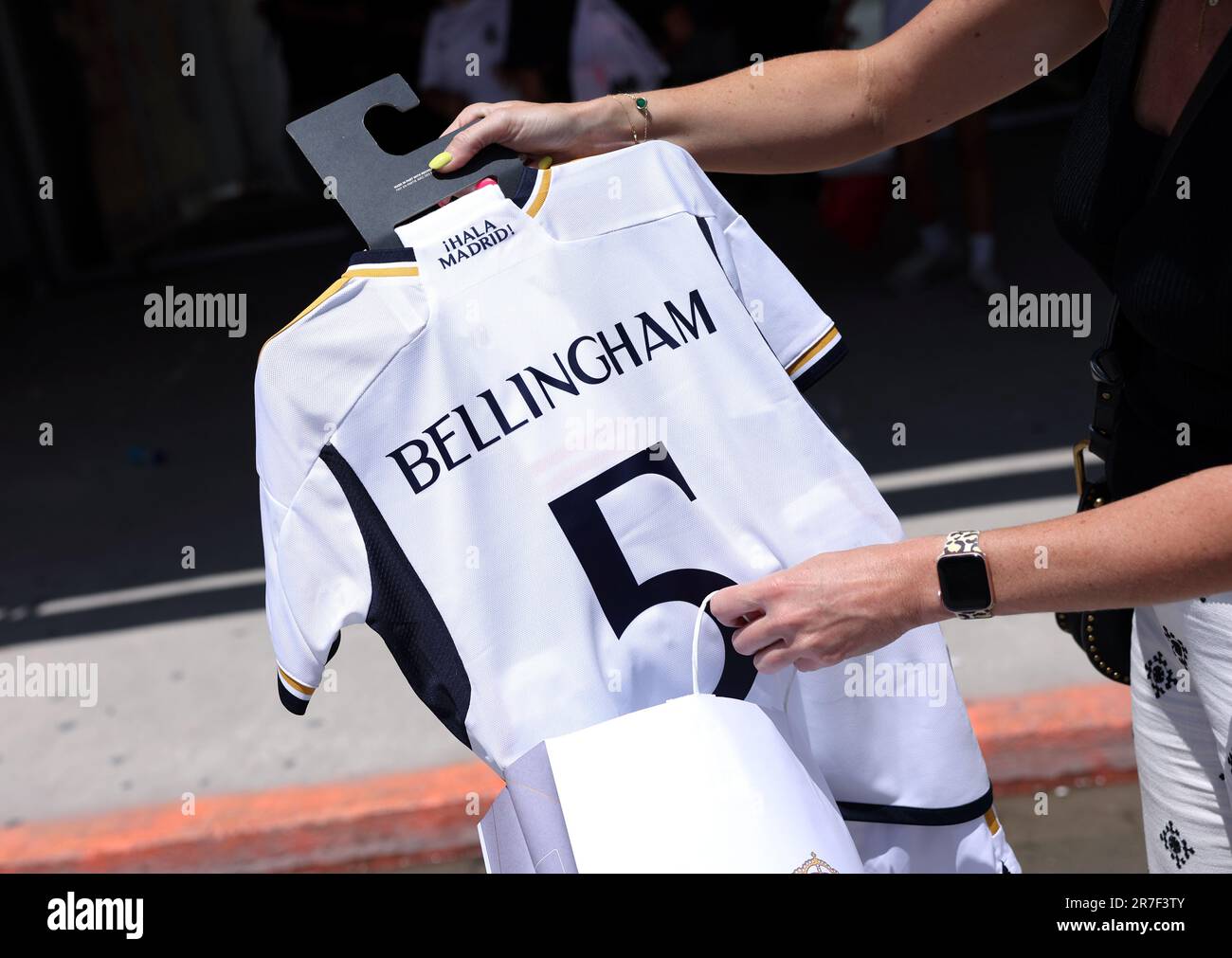 A Real Madrid fan with a shirt featuring the name and number of new ...