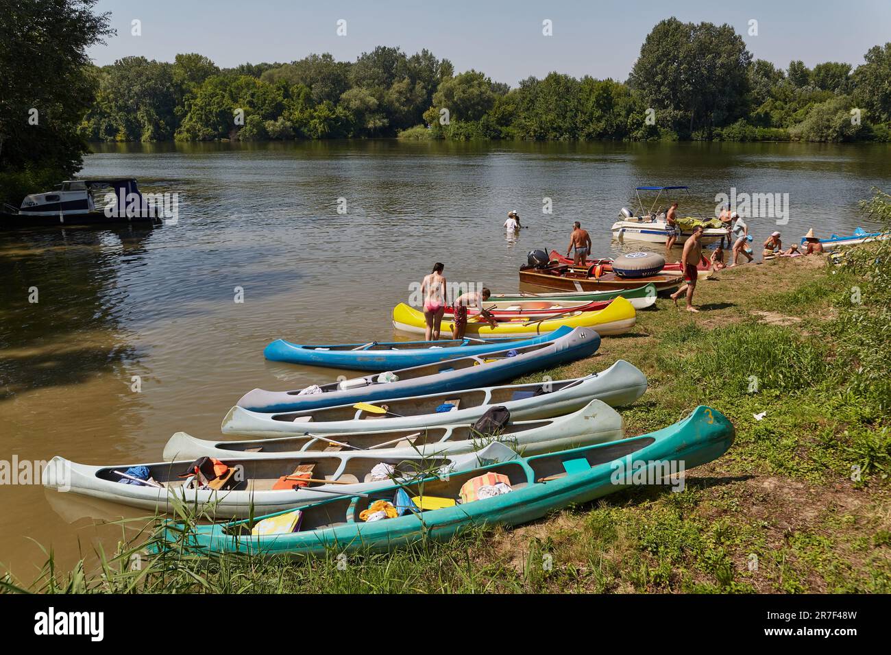 Canoes on the Riverside Stock Photo - Alamy