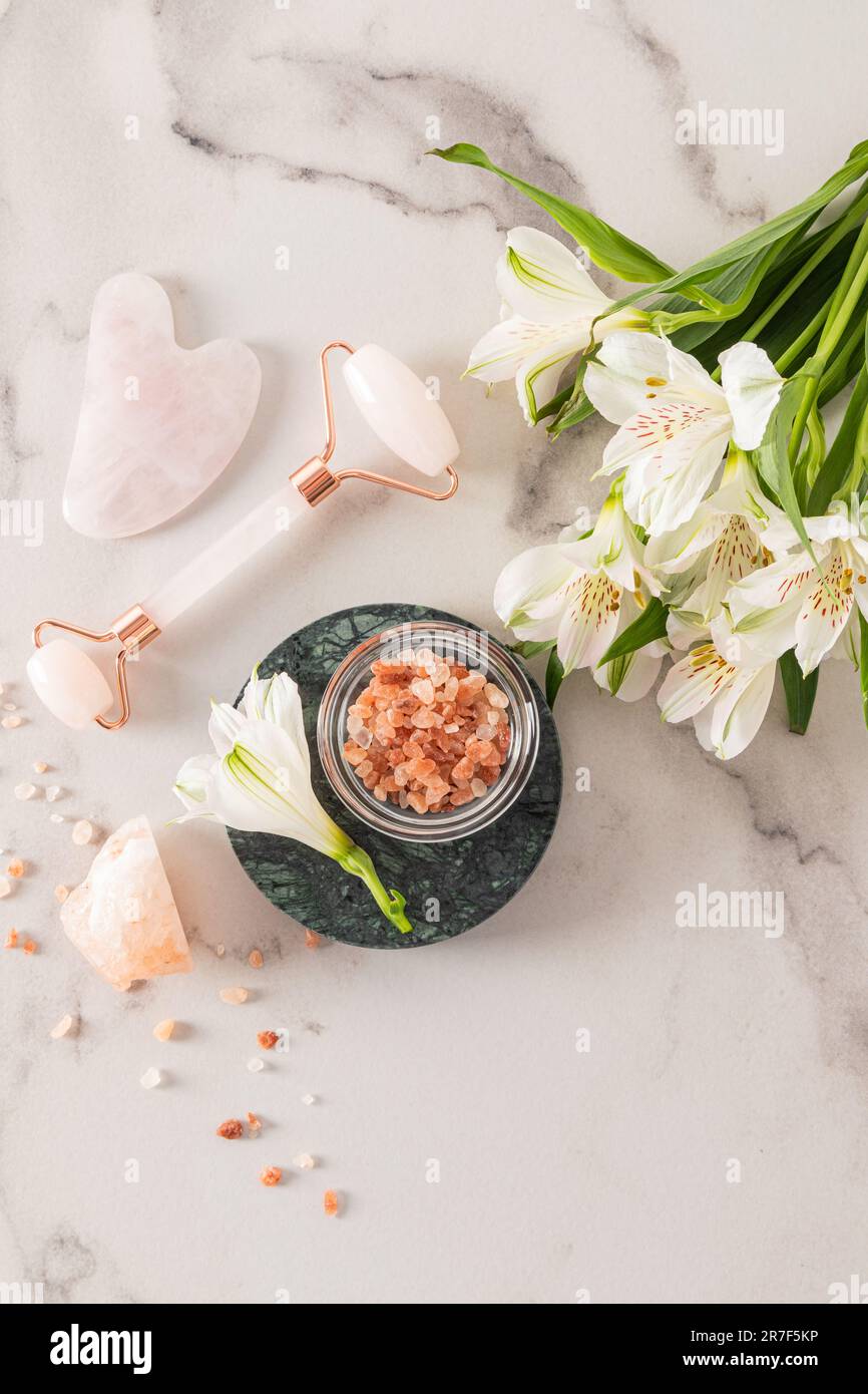 Cosmetic massager made of rose quartz for the face, neck and decal area ...