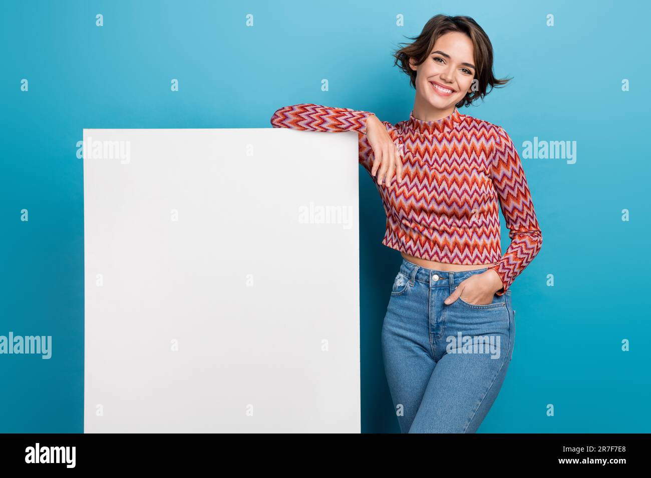 Photo of cheerful pretty woman dressed pink shirt holding placard empty ...