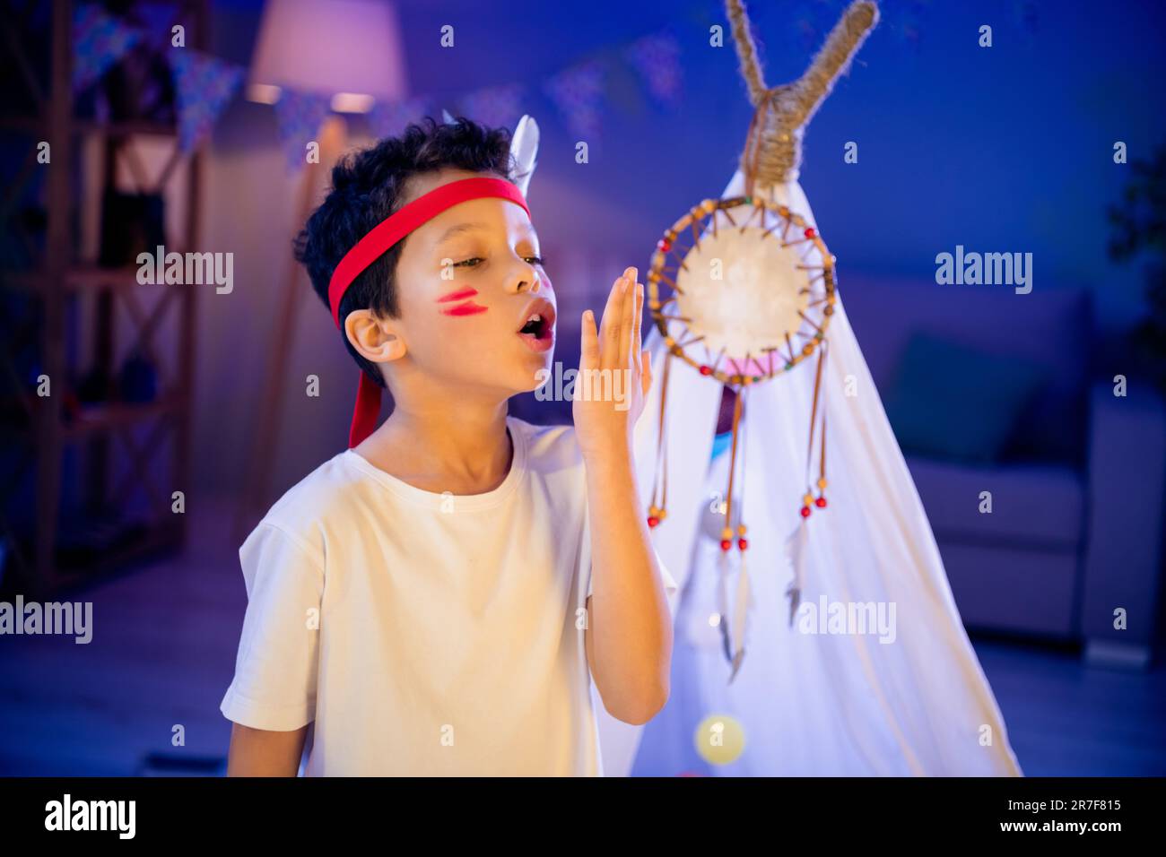 Photo of brave little kid playing game native americans battle crying ...