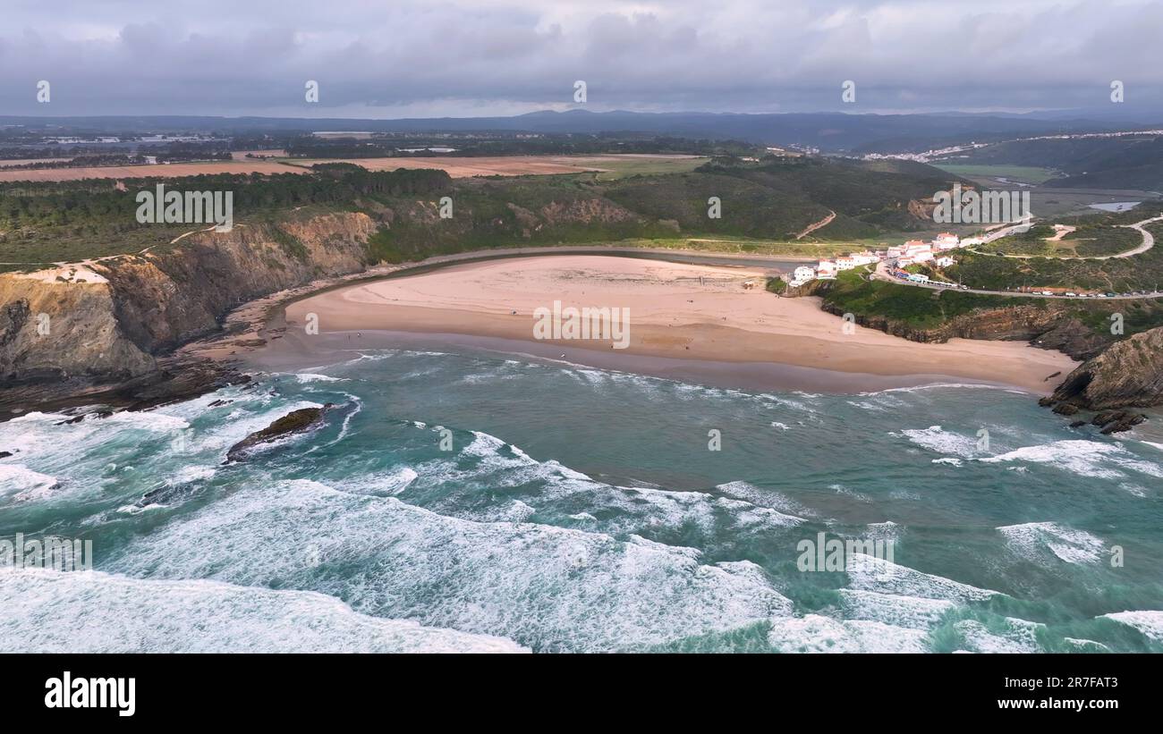 Aerial view of Praia de Odeceixe along Ribeira de Seixe river, Odeceixe ...