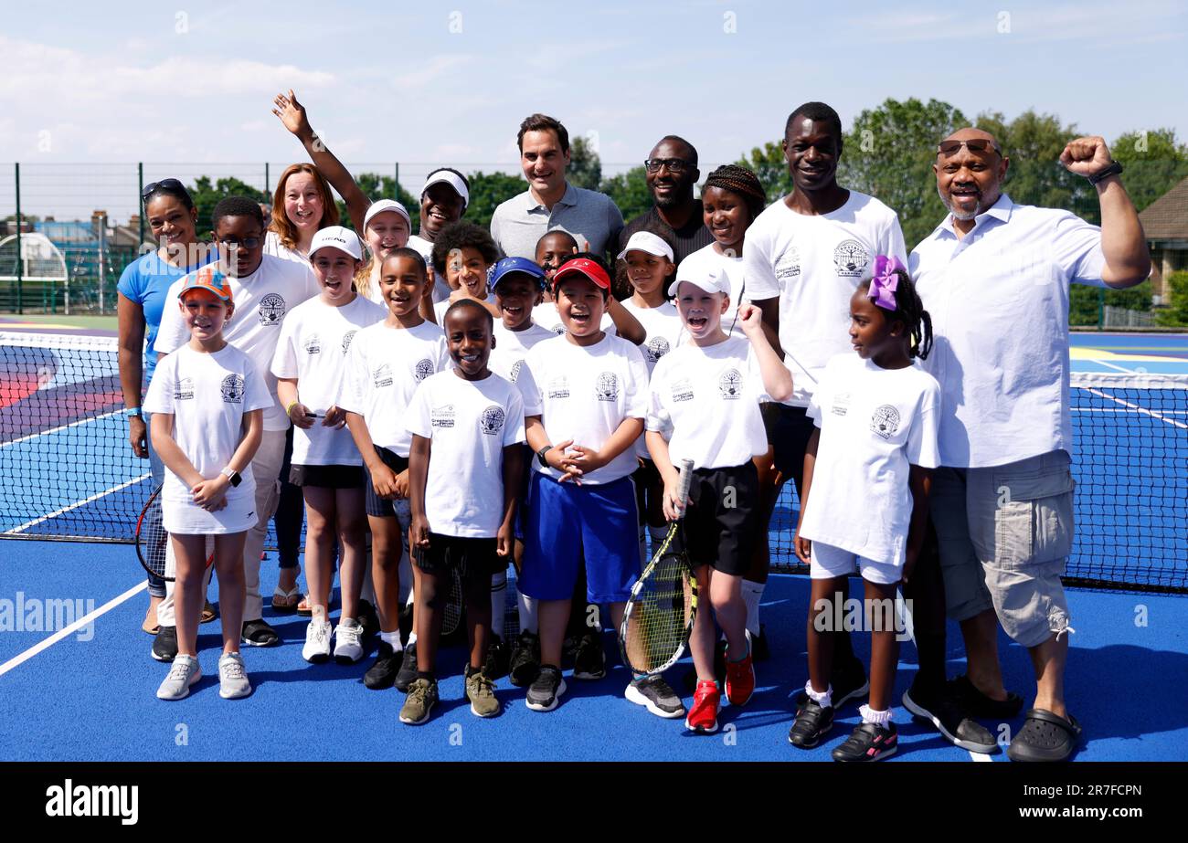 Roger Federer with local school children at the opening of newly ...