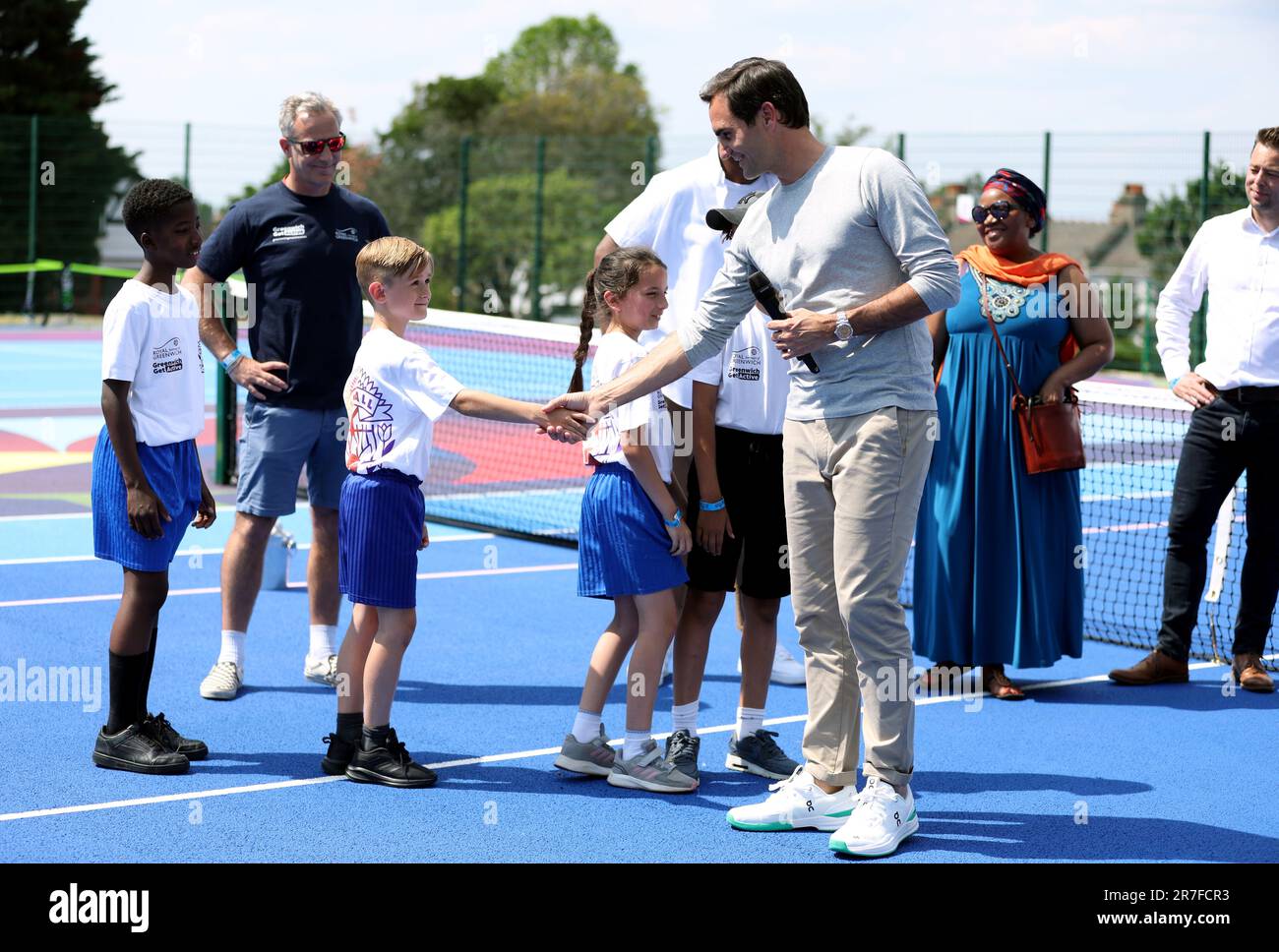 Roger Federer with local school children at the opening of newly ...
