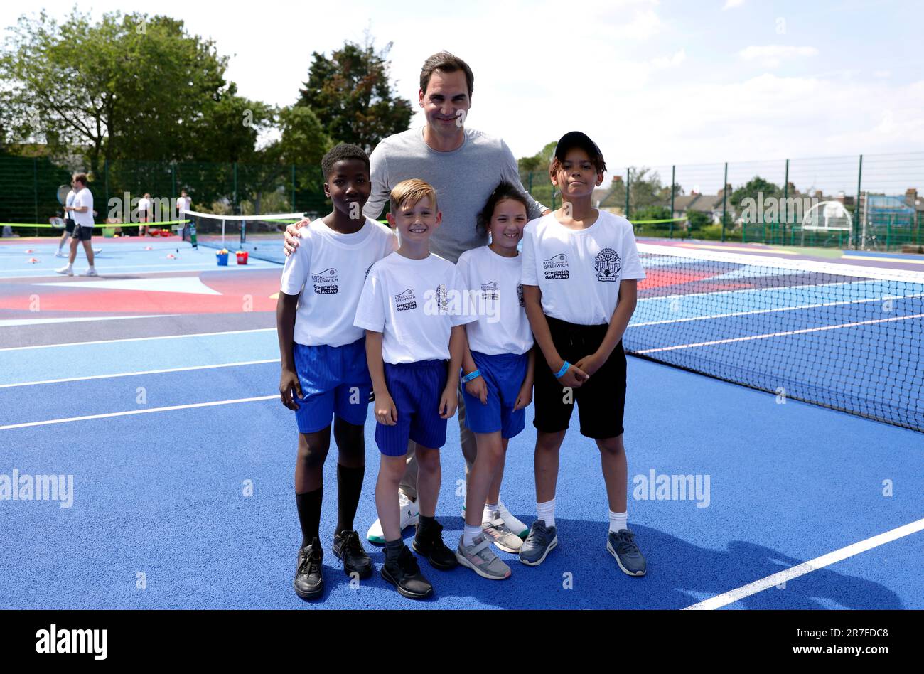Roger Federer with local school children at the opening of newly ...