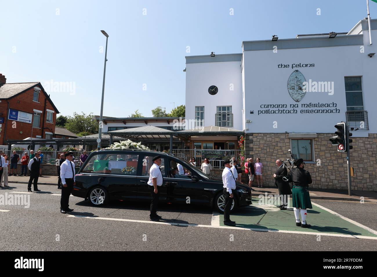 The coffin of Joe Clarke, one of a group known as the Hooded Men, stops ...