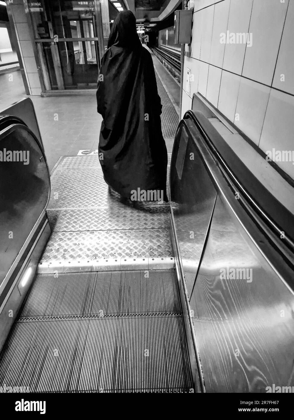 Muslim lady wearing traditional suit in a subway station, Lyon, France ...