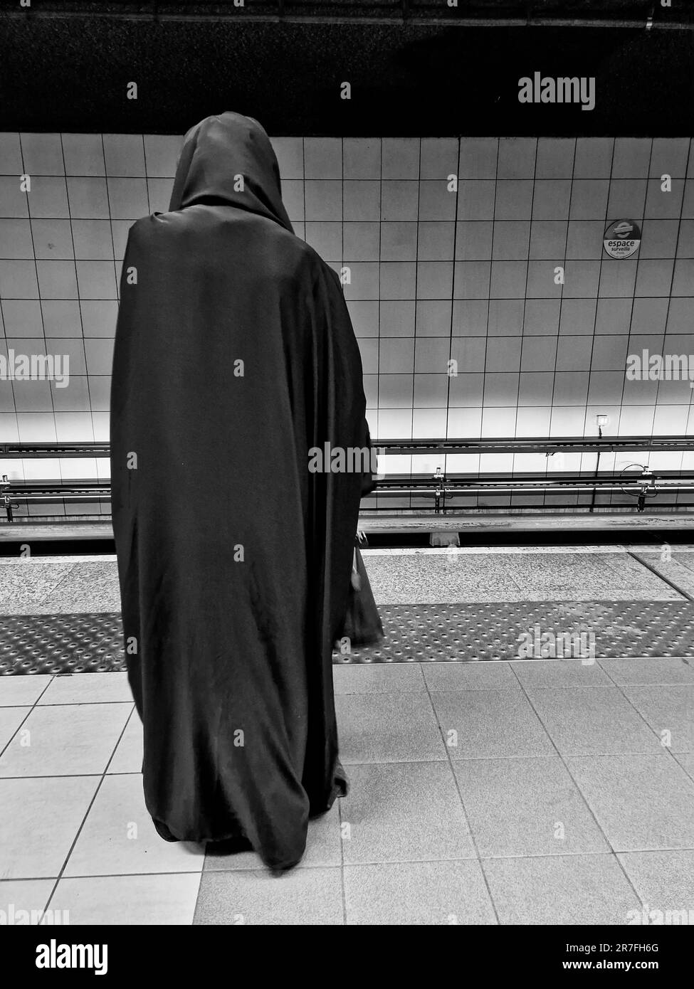 Muslim lady wearing traditional suit in a subway station, Lyon, France ...
