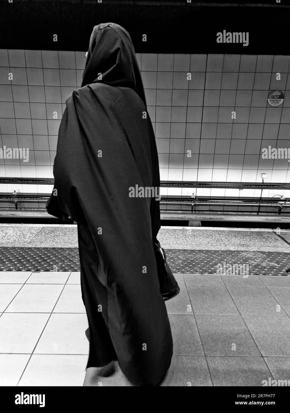 Muslim lady wearing traditional suit in a subway station, Lyon, France ...