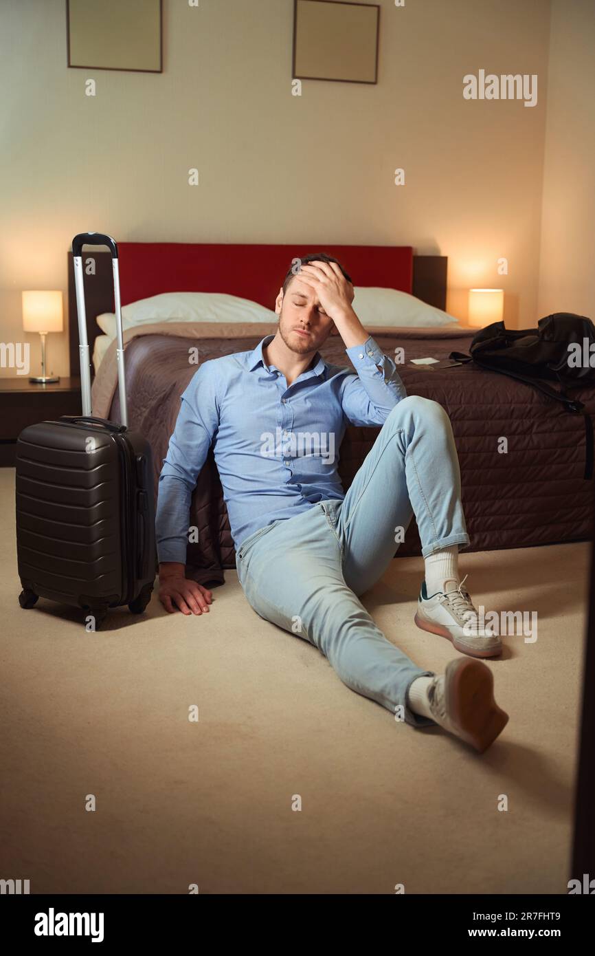Man hotel room headache hi-res stock photography and images - Alamy