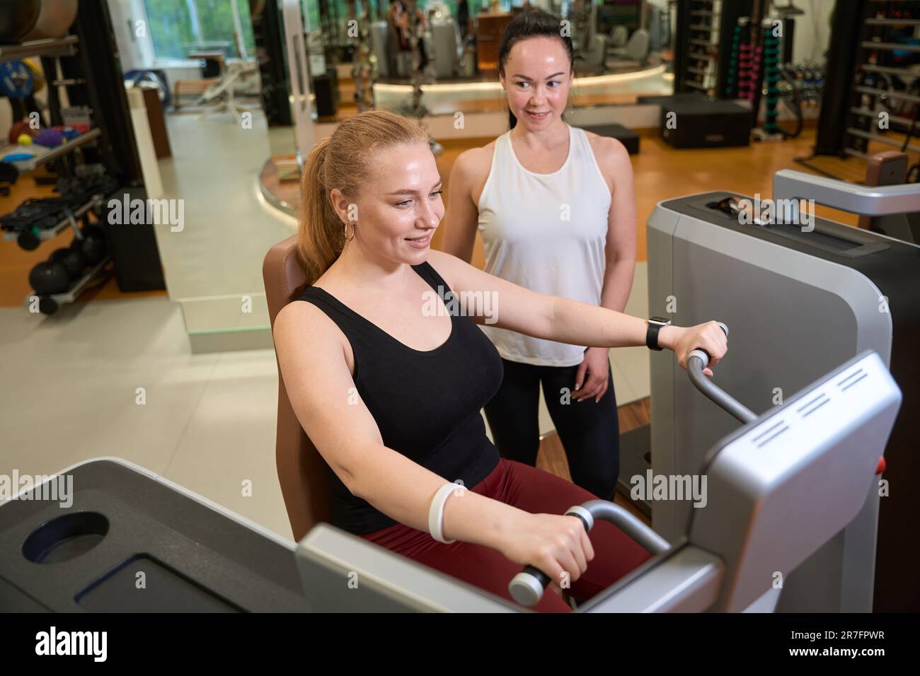 Two females are in the gym of the fitness clinic Stock Photo - Alamy