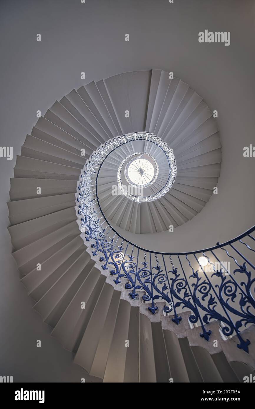 A low-angle of stunning spiral English staircase with intricate designs ...