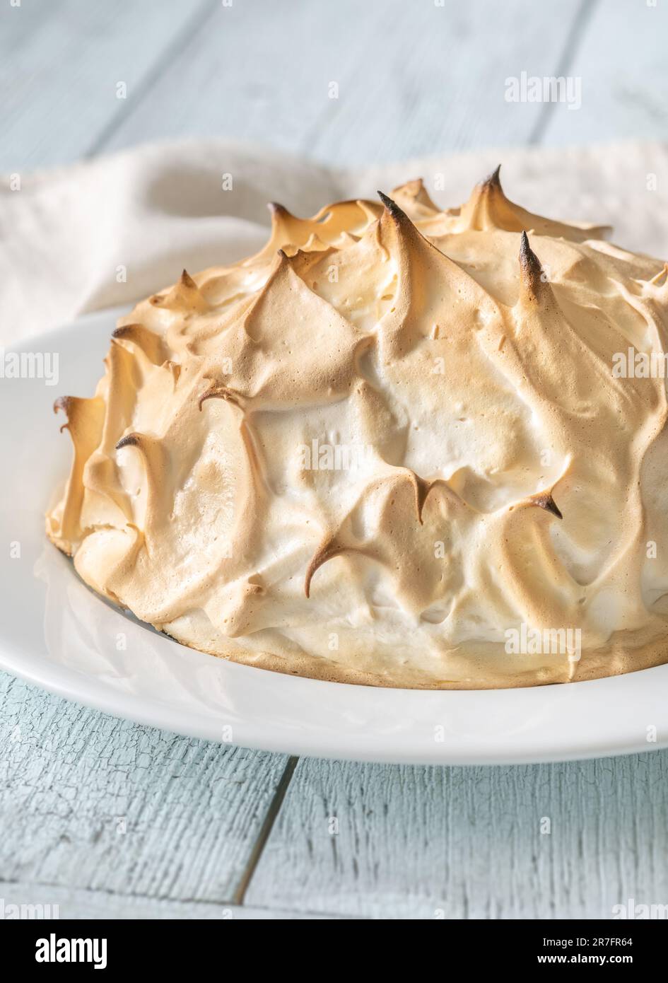 Baked Alaska dessert consisting of ice cream and browned meringue Stock ...