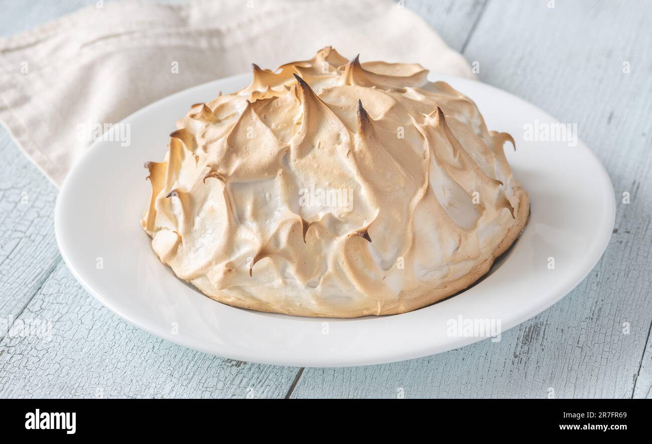 Baked Alaska dessert consisting of ice cream and browned meringue Stock ...