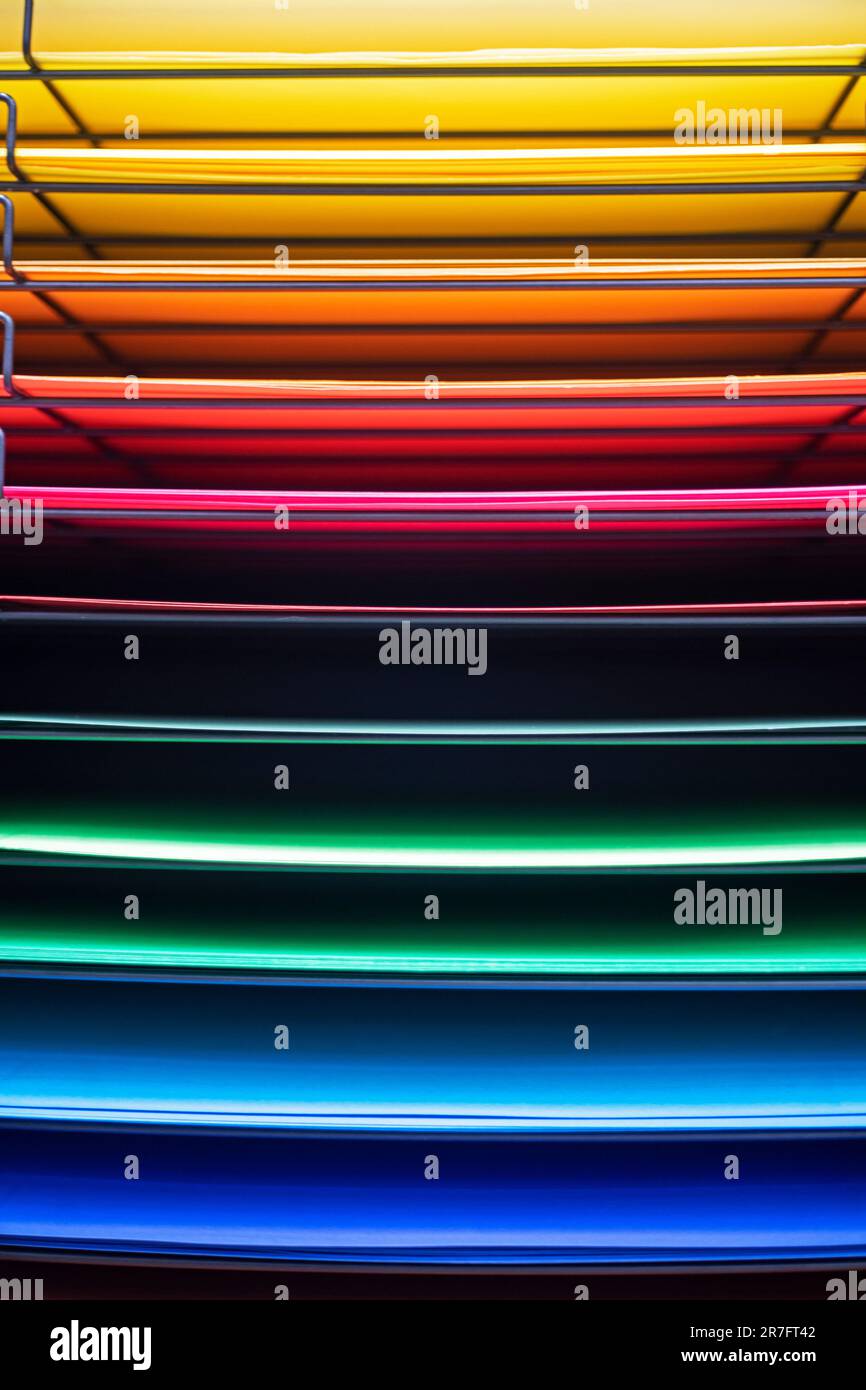 abstract background of multi-colored design paper laid out on the ...