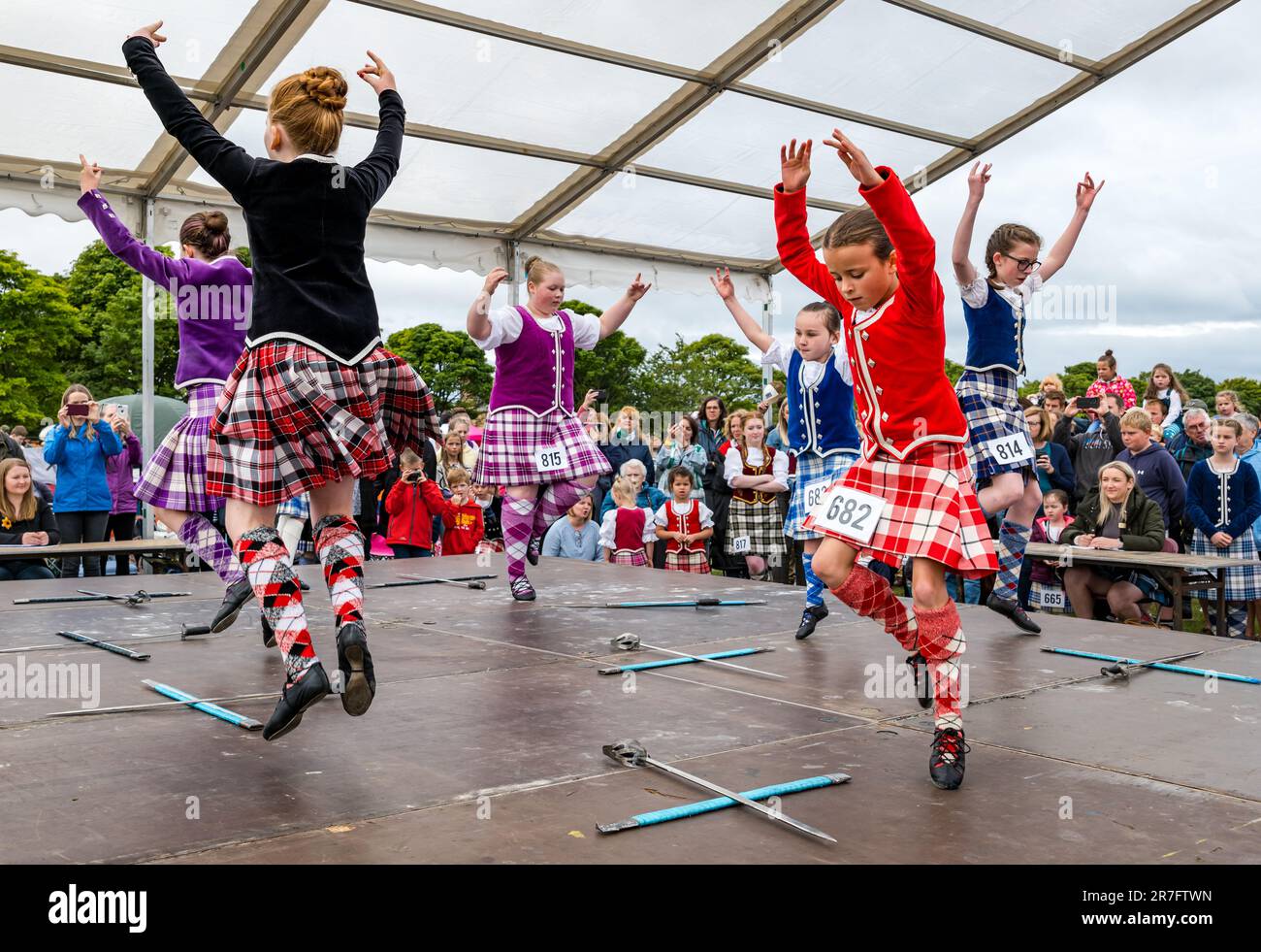 Young girls competing in highland sword dancing event wearing ...