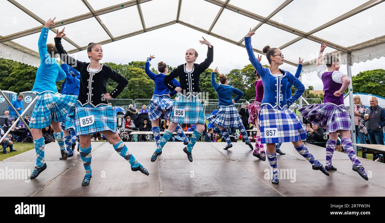 Girls competing in highland dancing event wearing traditional Scottish ...