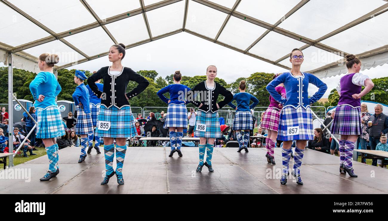 Girls competing in highland dancing event wearing traditional Scottish ...